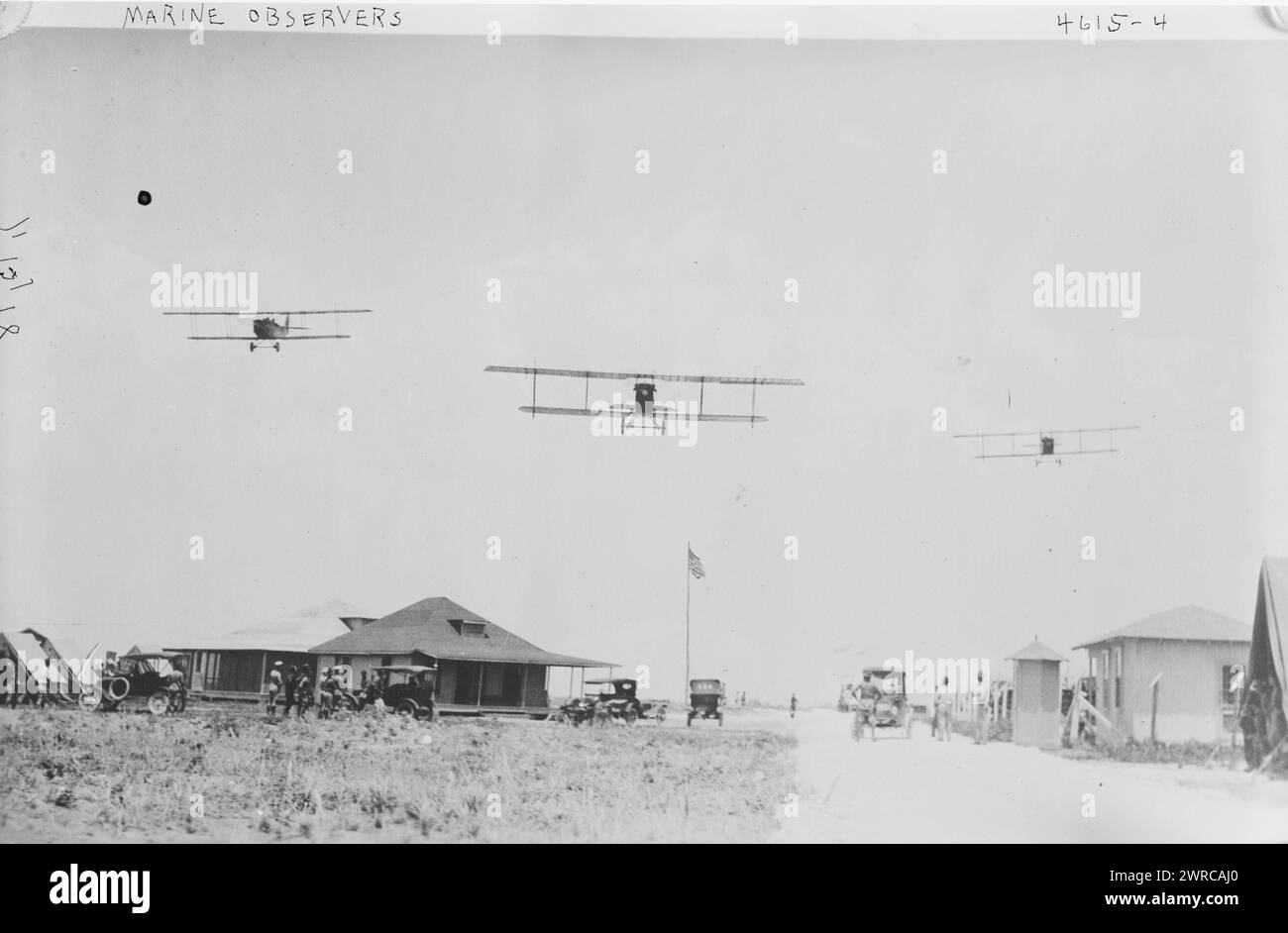 Marine observers, Photograph shows airplanes flying over buildings at ...