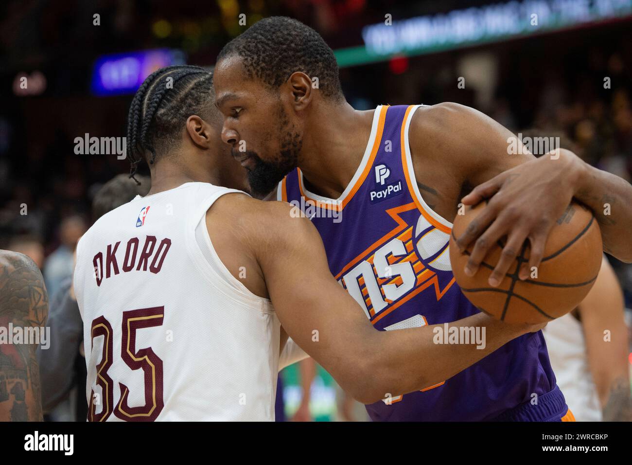 Cleveland Cavaliers' Isaac Okoro, right, gets a hug from Phoenix Suns ...