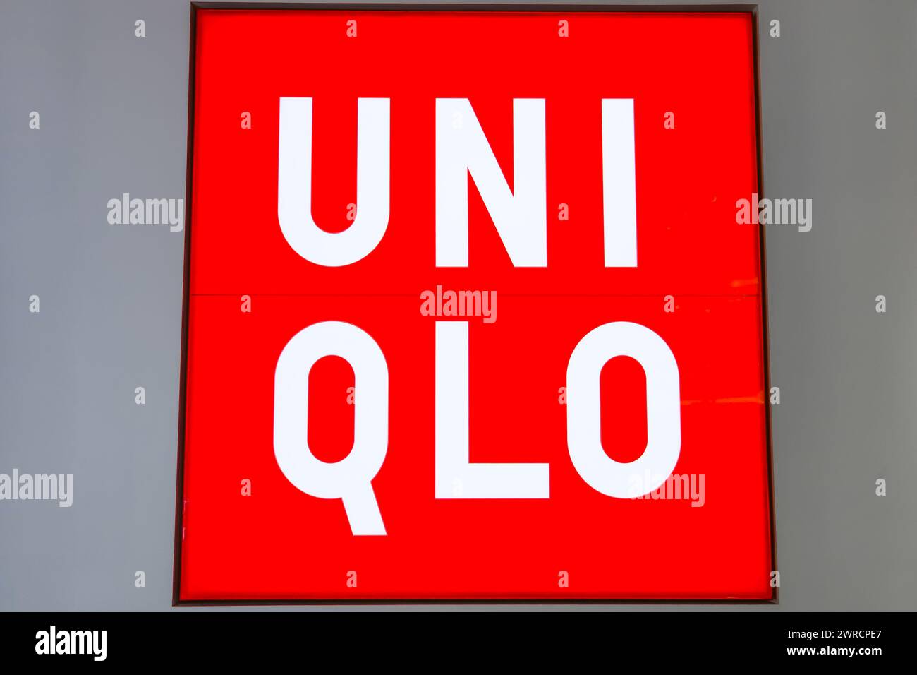 Square decoration sign and logo of a Uniqlo store, a commercial brand ...