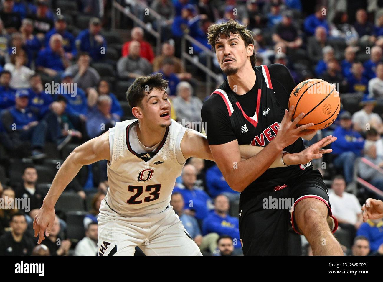 Nebraska-Omaha Mavericks forward Frankie Fidler (23) fouls a driving ...