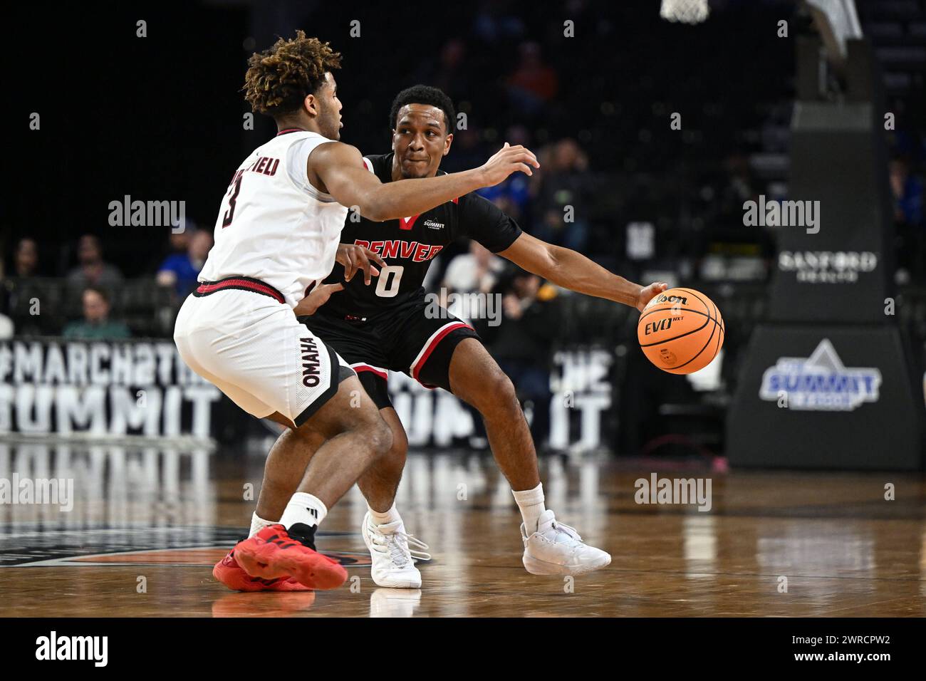 Denver Pioneers guard Tommy Bruner (0) brings the ball up the court ...