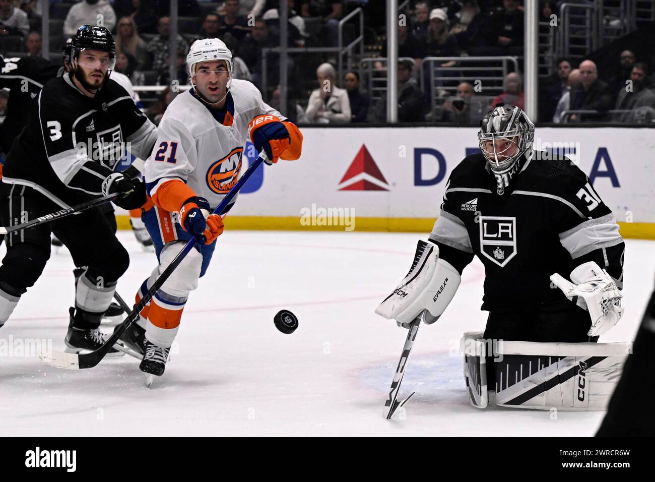 Los Angeles Kings goaltender David Rittich (31) deflects a shot by New ...