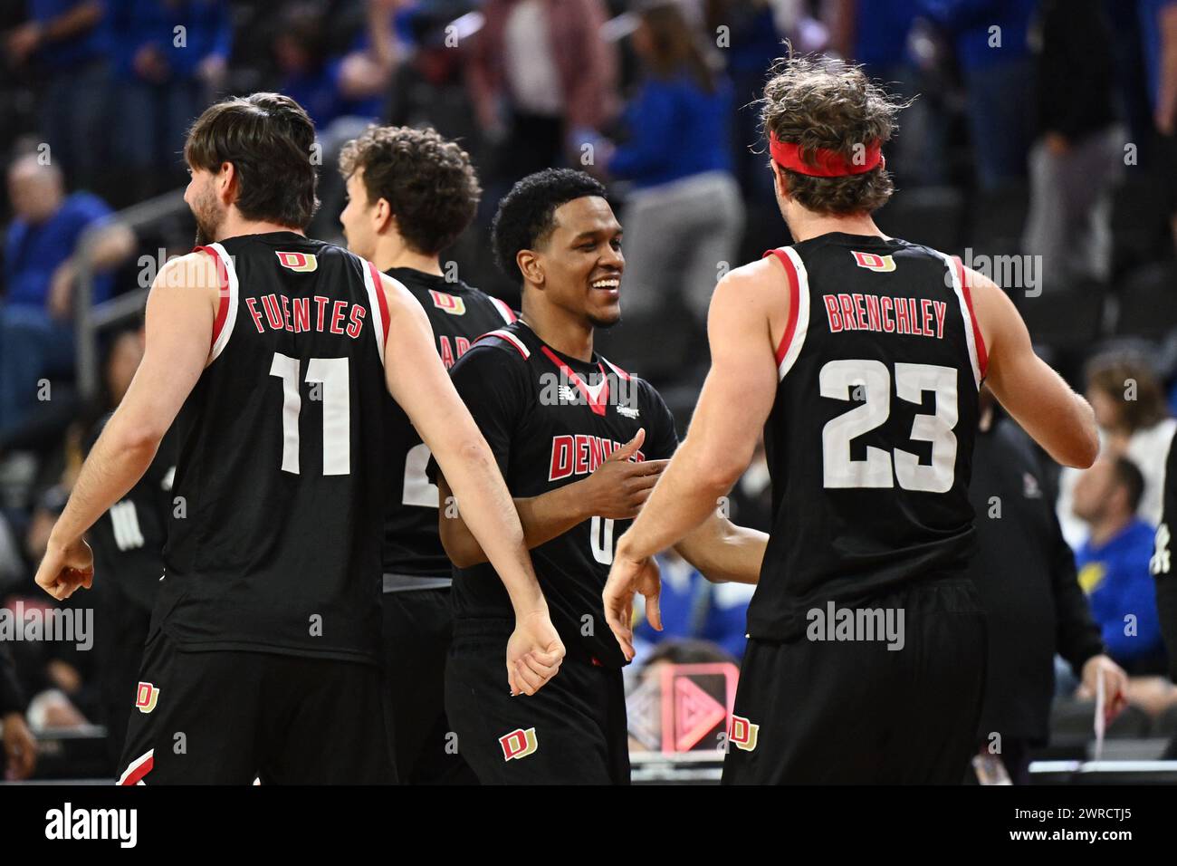 Denver Pioneers guard Tommy Bruner (0) celebrates with teammates after ...