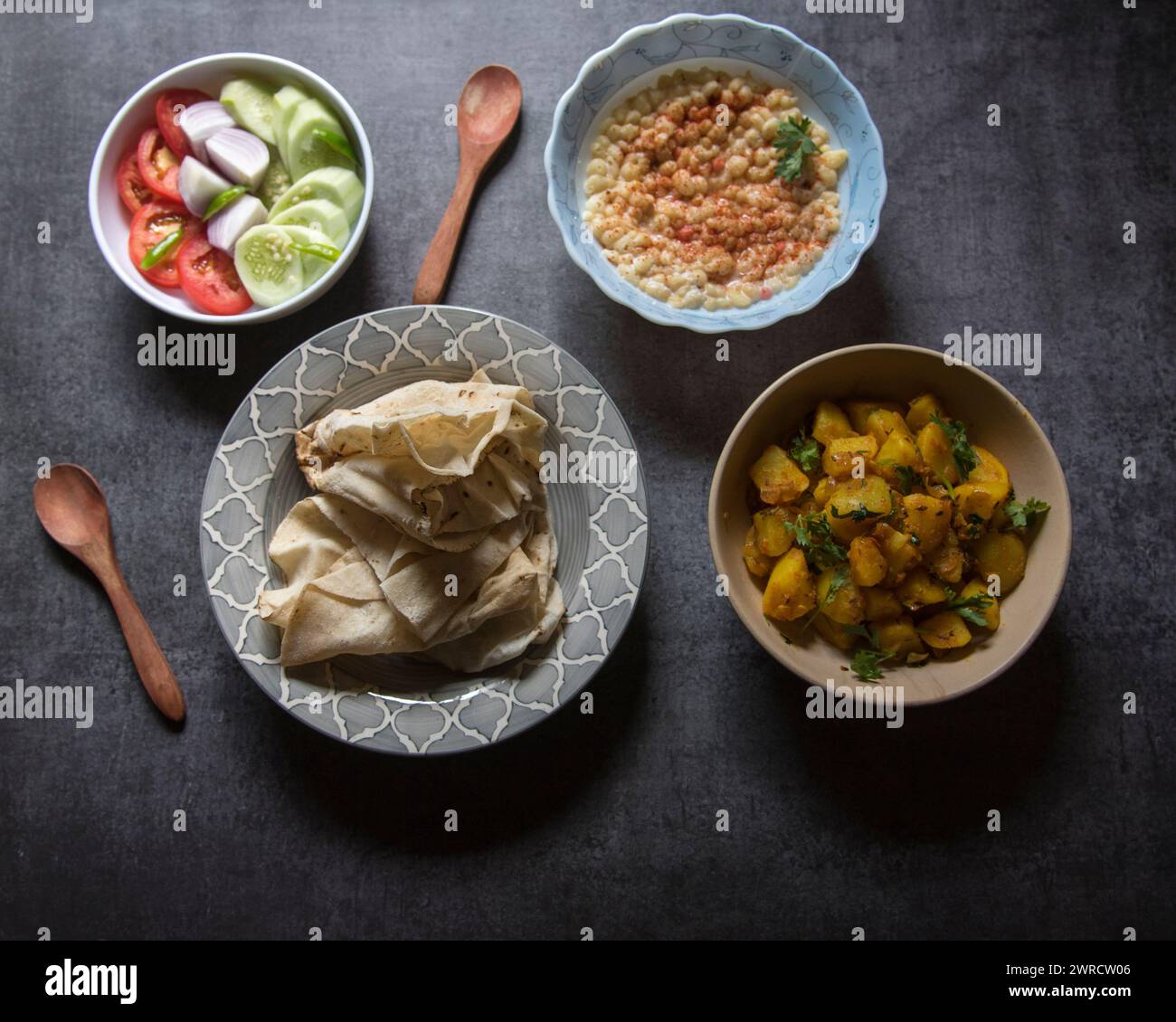 Indian street food alu jeera or potato masala served in a bowl. Top ...