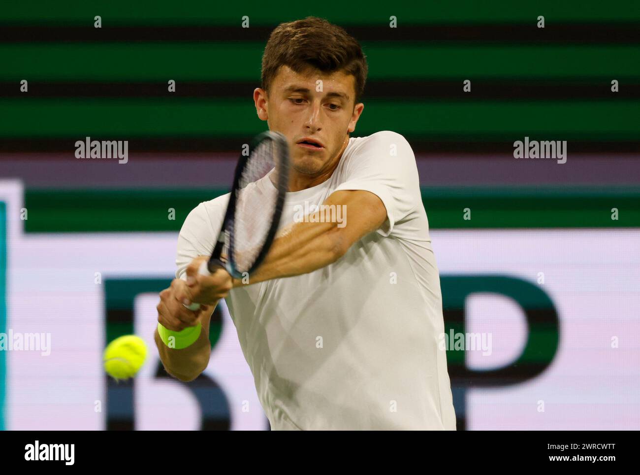March 11, 2024 Luca Nardi of Italy returns a shot against Novak ...