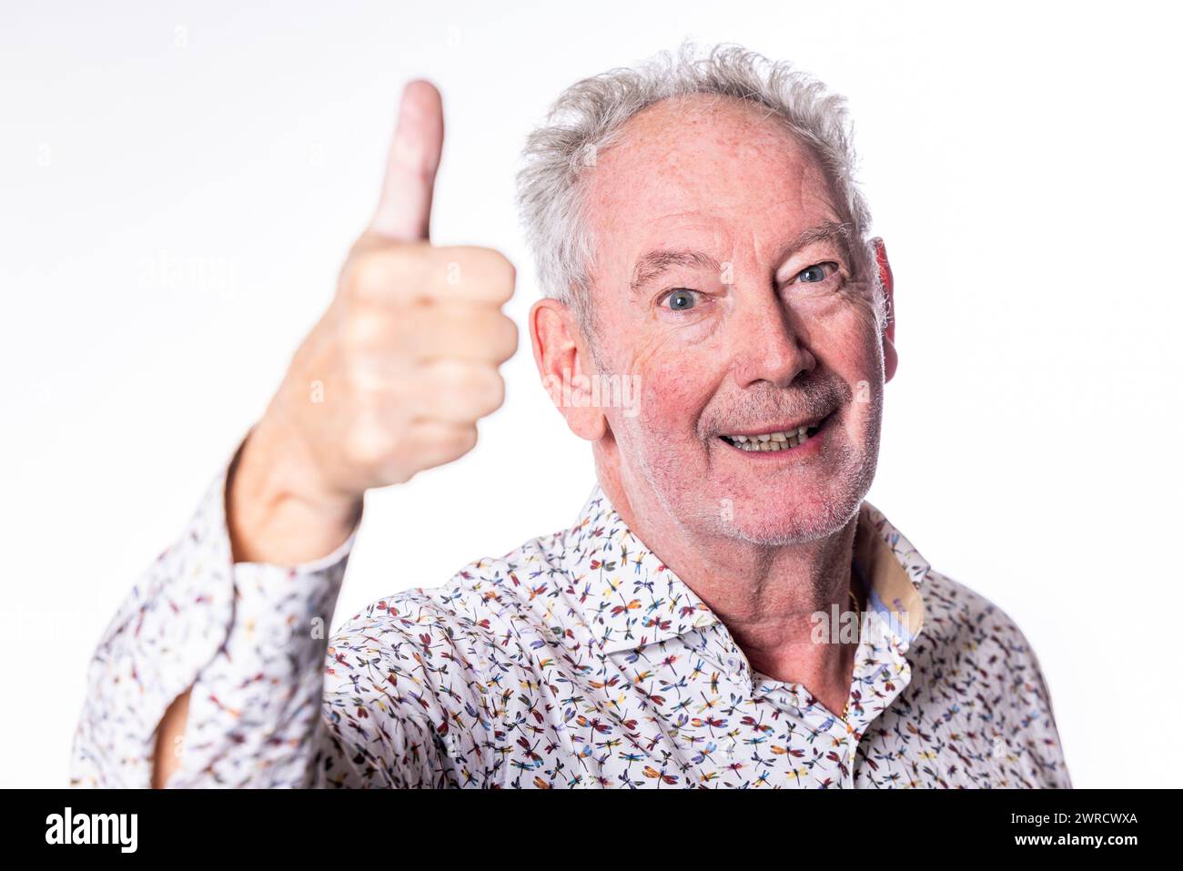 Elderly Man with Thumbs Up: A Portrait of Close-up of a spirited senior ...