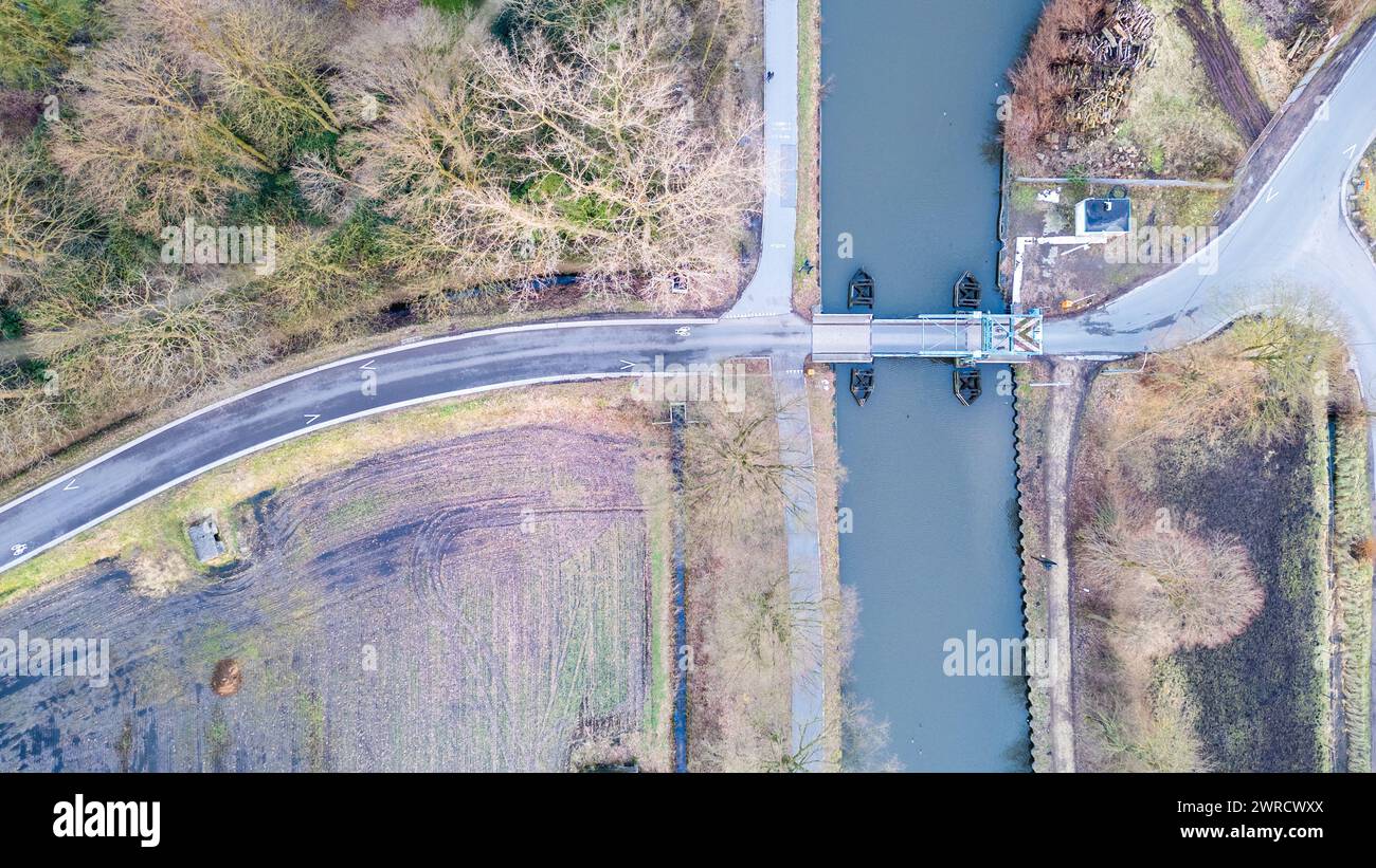 This image captures an aerial perspective of a canal intersecting with ...