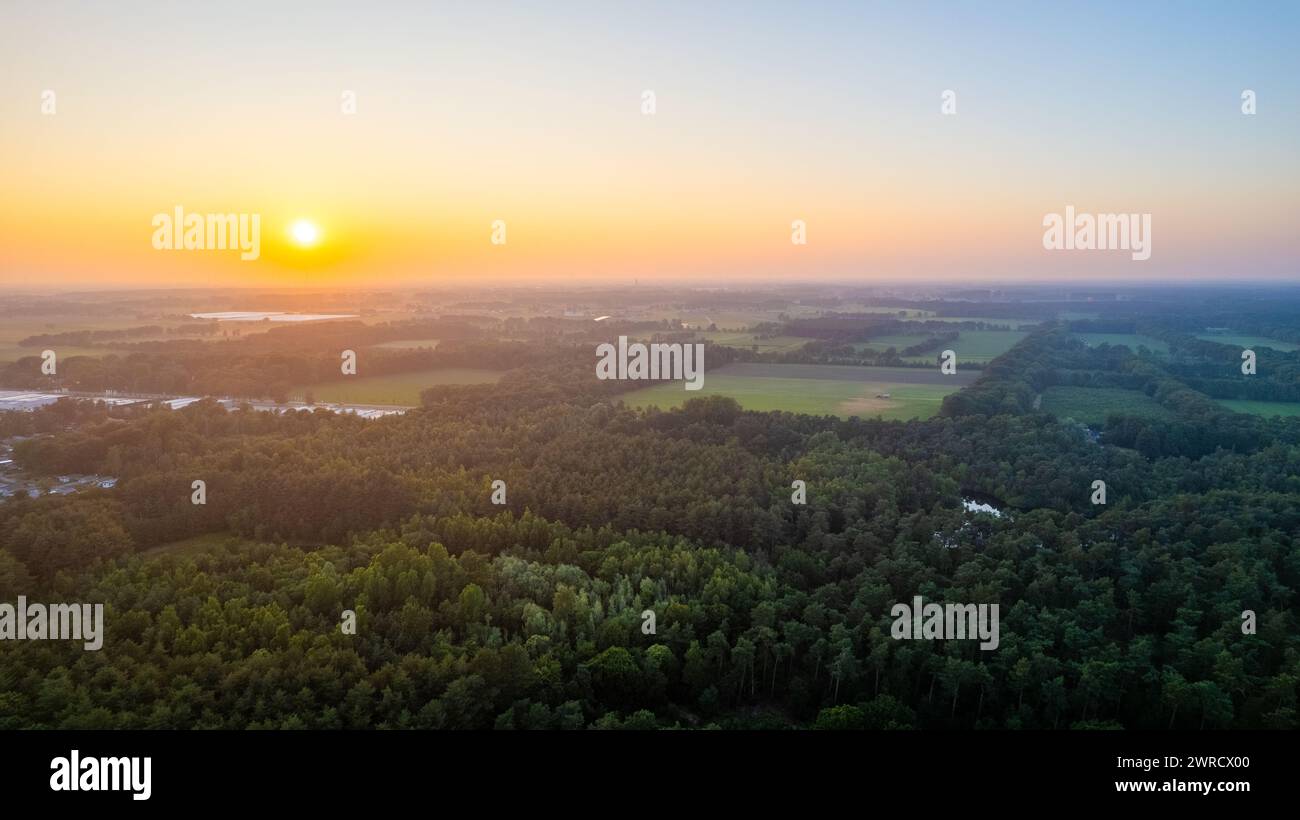 This image captures the serene beauty of a sunset horizon viewed from ...