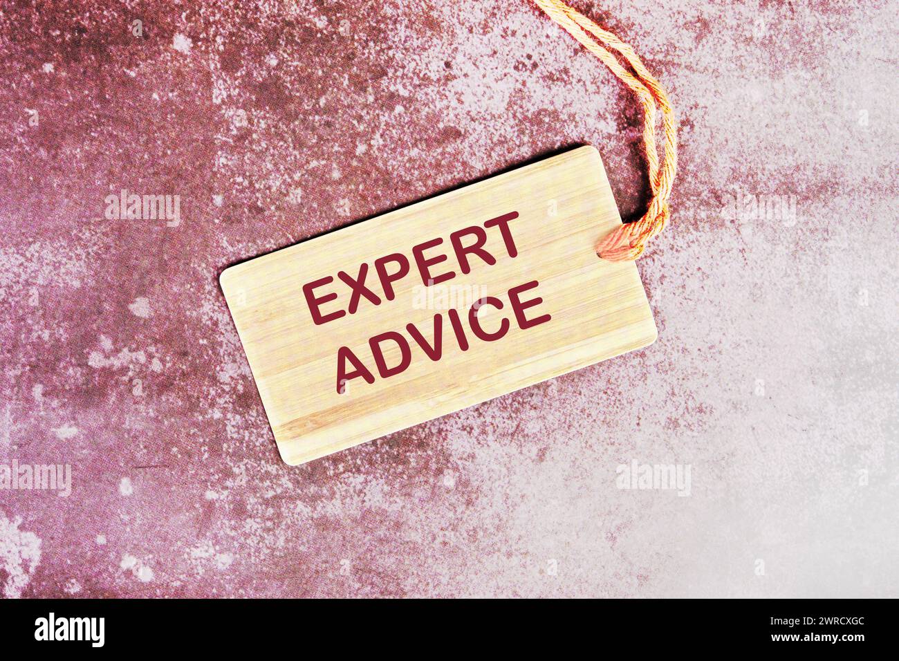 Expert Advice text on the card with the rope Stock Photo - Alamy
