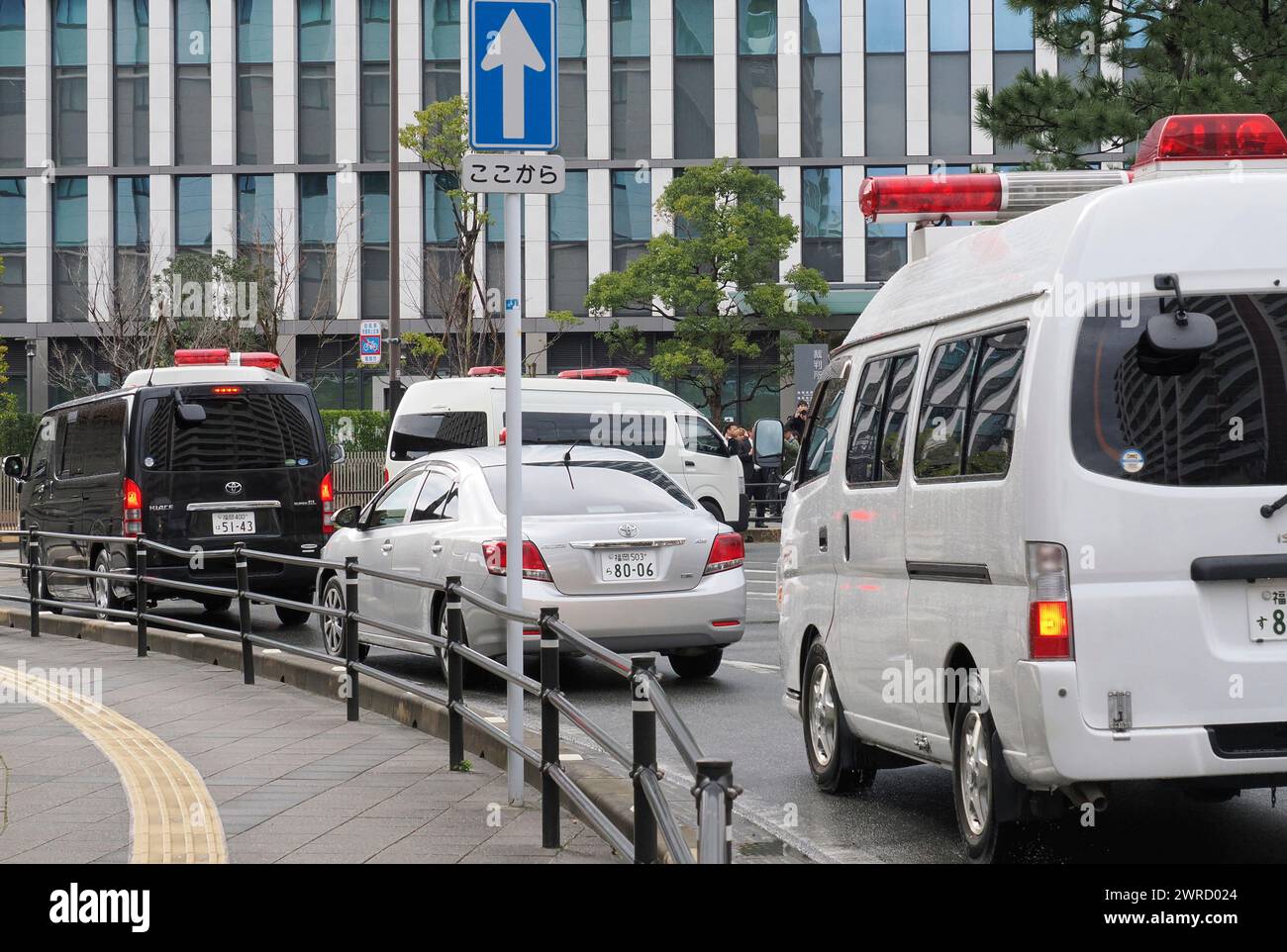 A motorcade believed to be carrying defendants Satoru Nomura and Fumio ...
