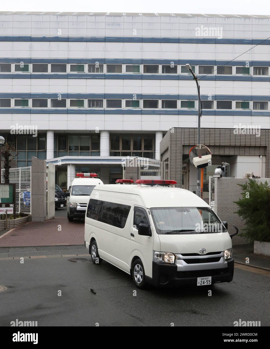 A motorcade believed to be carrying defendants Satoru Nomura and Fumio ...