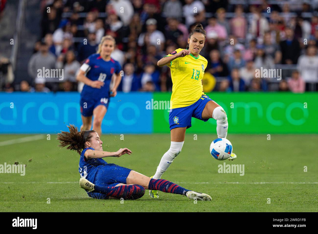 Brazil forward Gabi Portilho (18) evades a slide tackle by United ...
