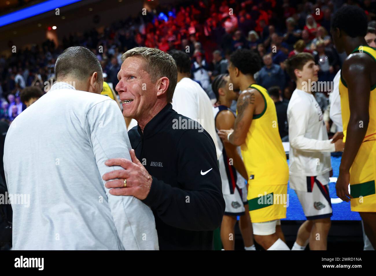 Gonzaga head coach Mark Few, right, speaks with San Francisco head ...