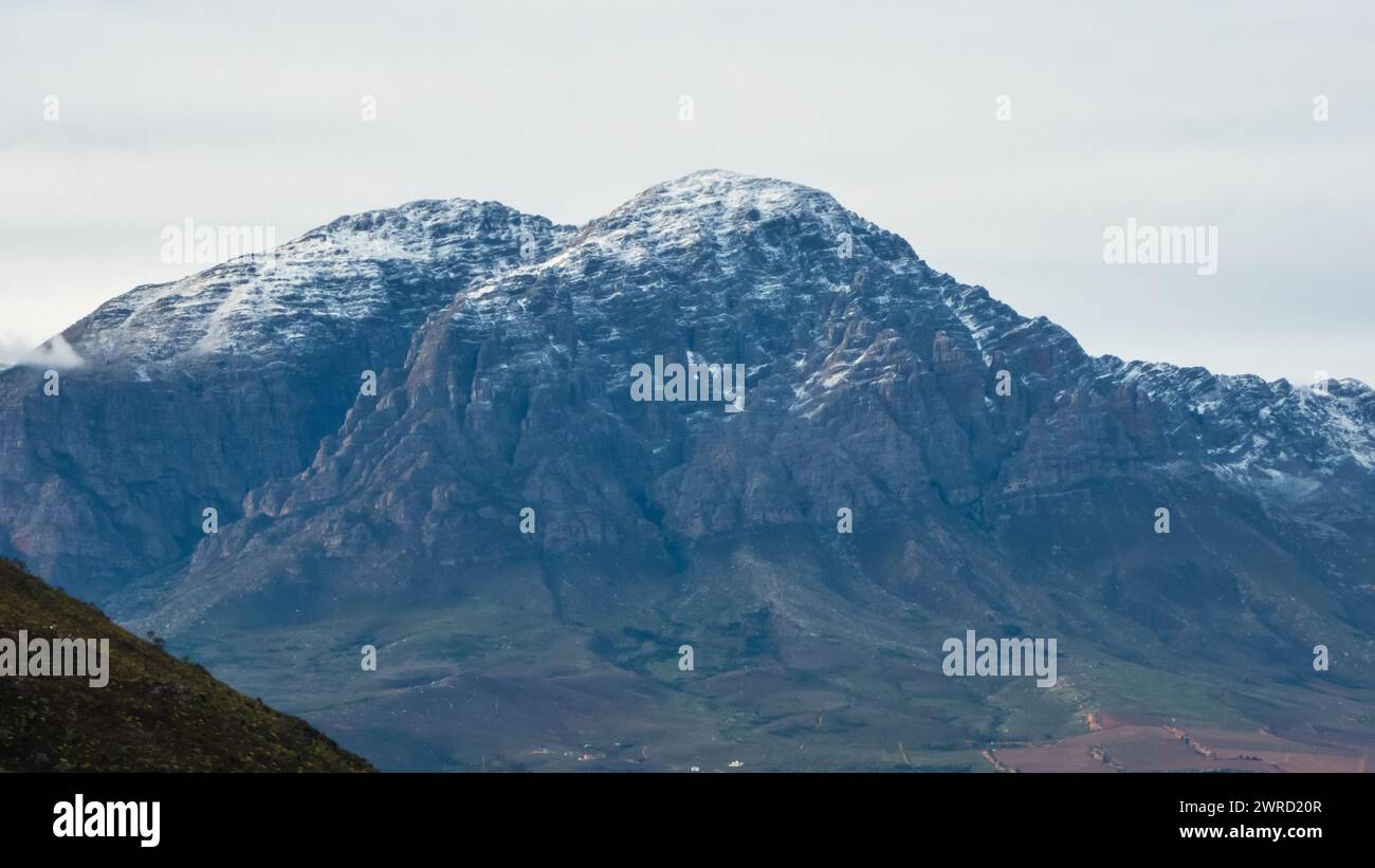 A scenic view of snow-capped mountains in the Breede Valley area, South ...