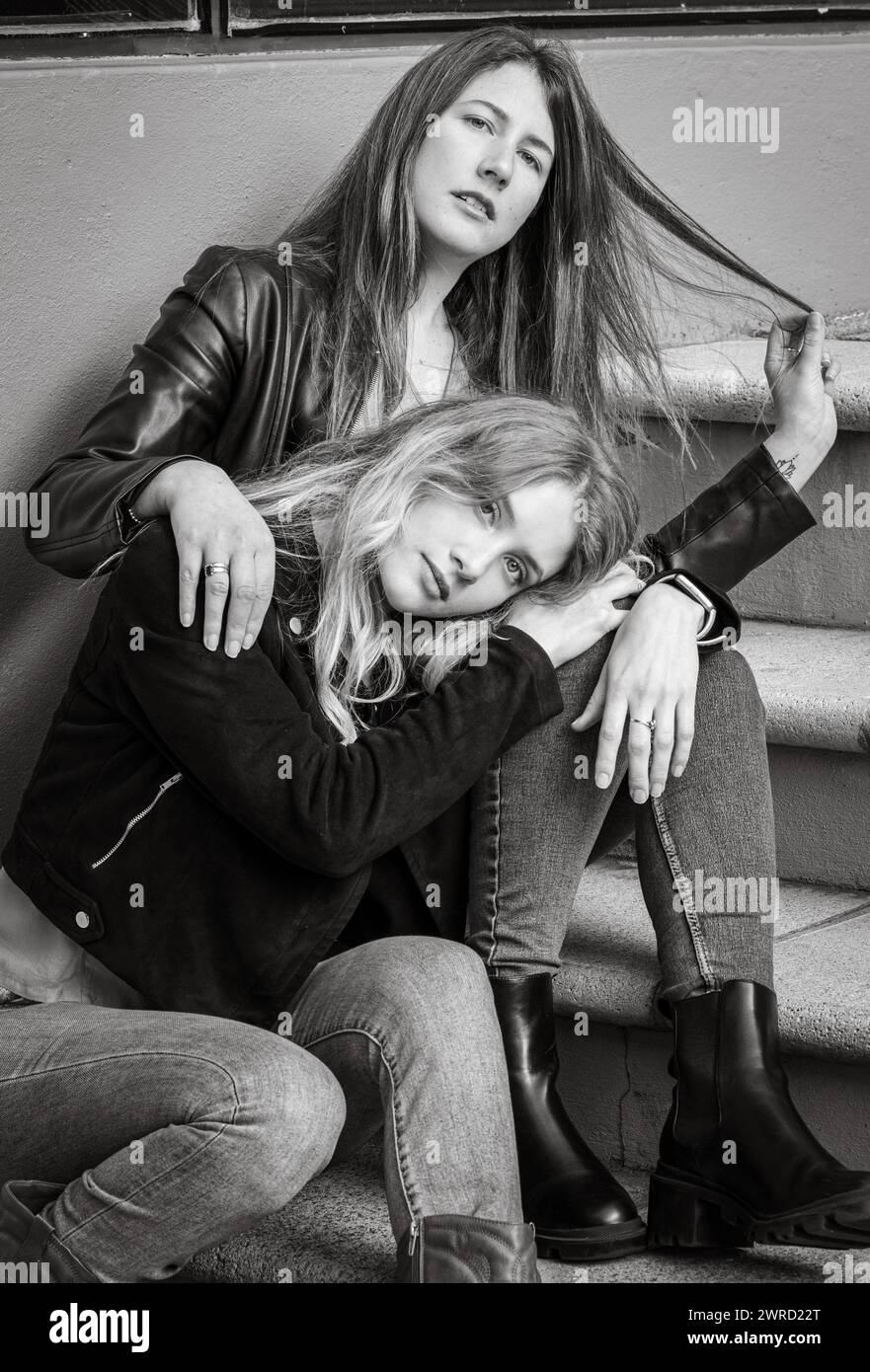 Two people sitting on stairs hi-res stock photography and images - Alamy