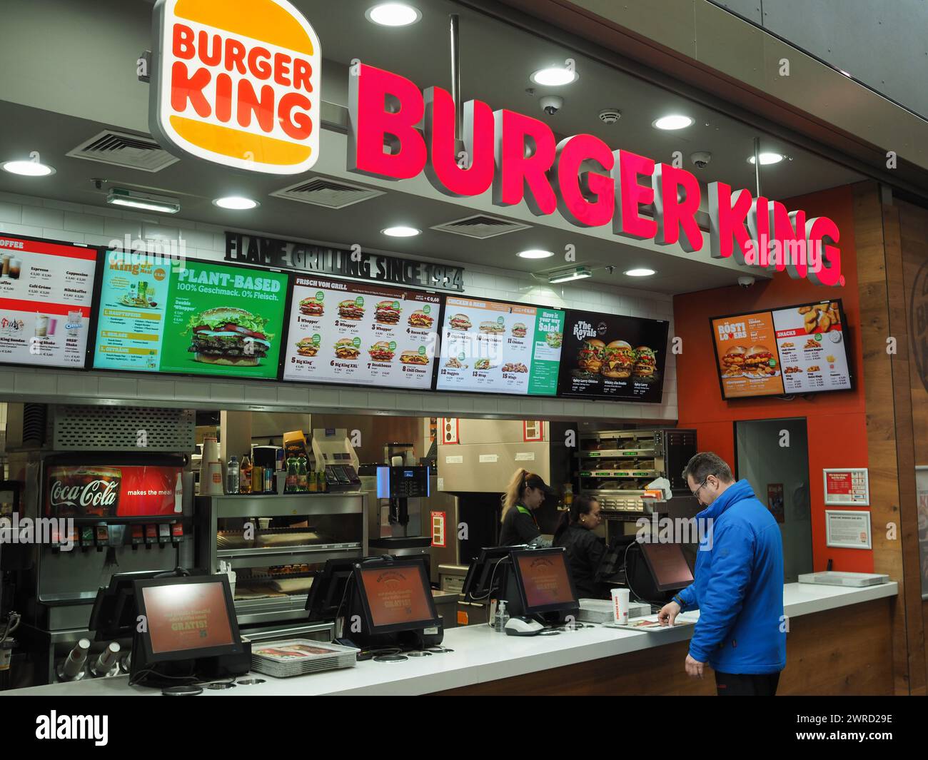 A customer is seen at the Fast food restaurant, Burger King in the main ...