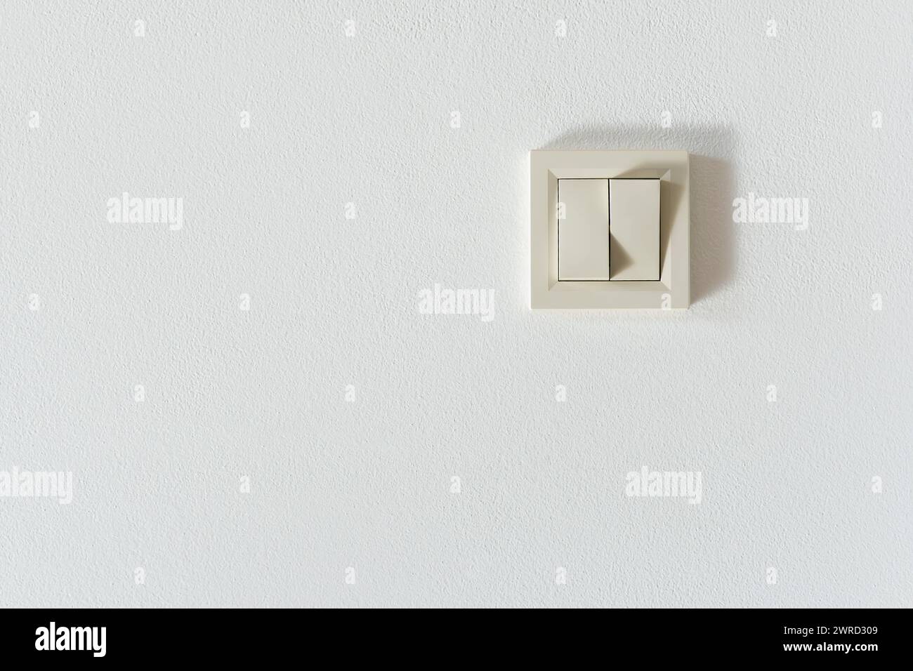 Front view of an electrical switch on a white wall Stock Photo - Alamy