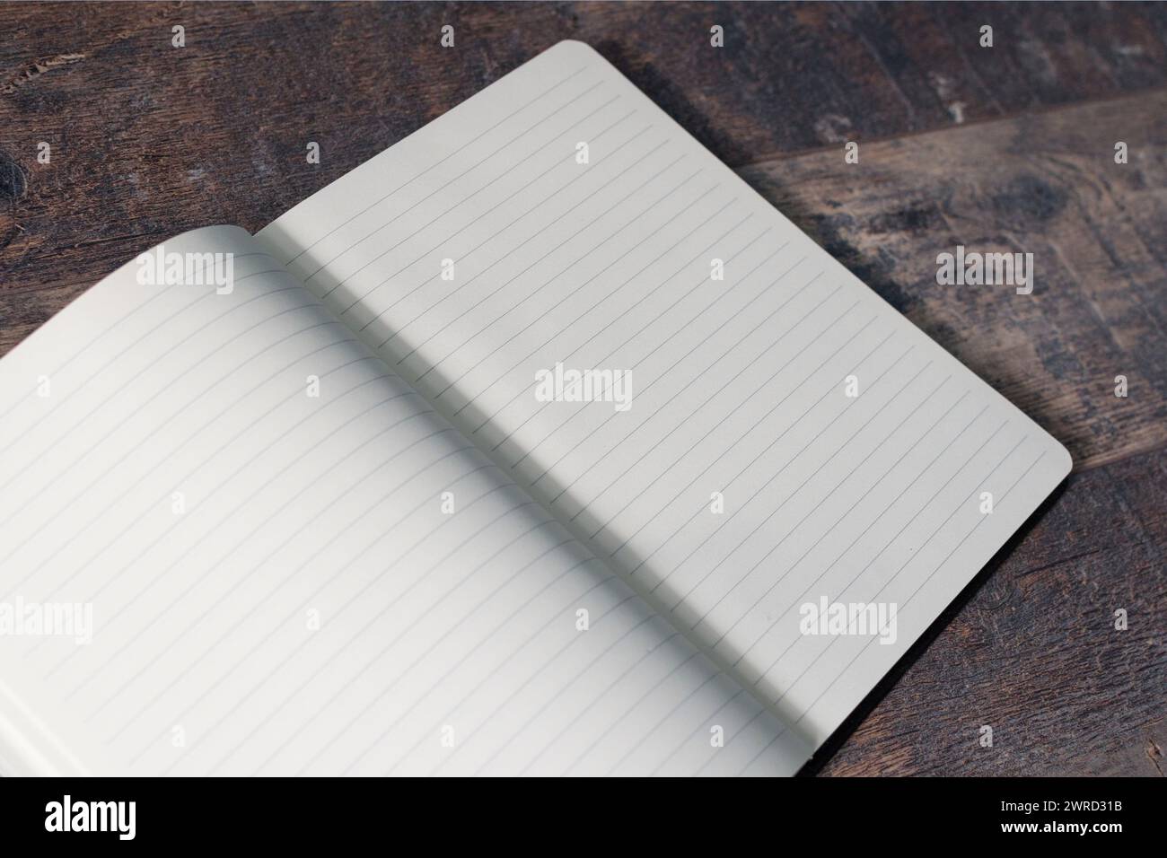 An open notebook for writing, blank sheets. wooden vintage table ...