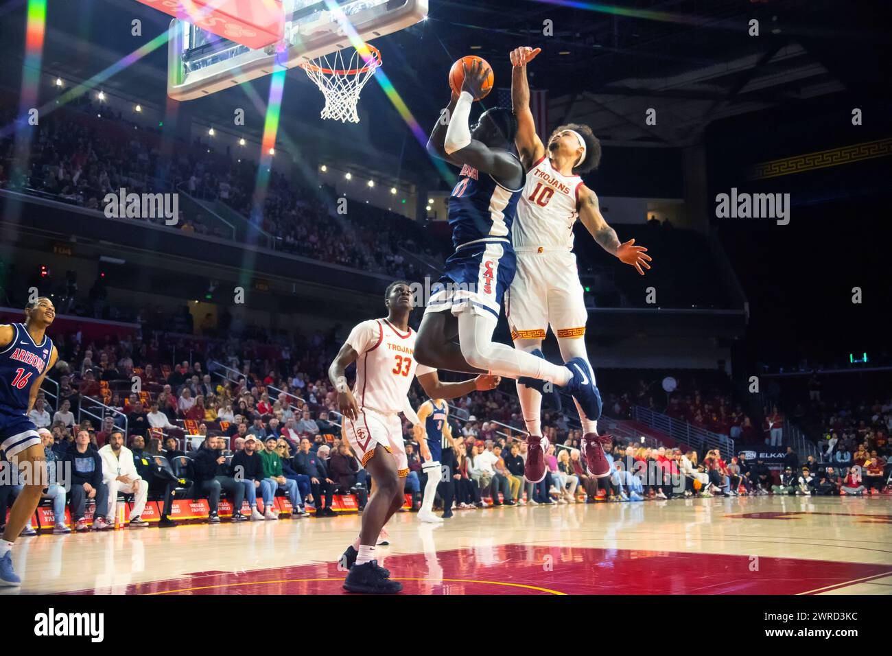 Arizona Wildcats center Oumar Ballo (11) scores on USC Trojans forward ...