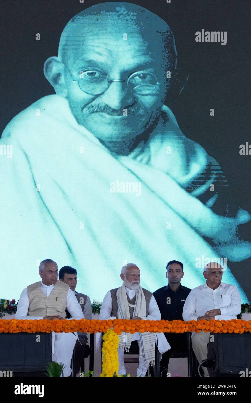 Indian Prime Minister Narendra Modi, center, sits during the launch of ...