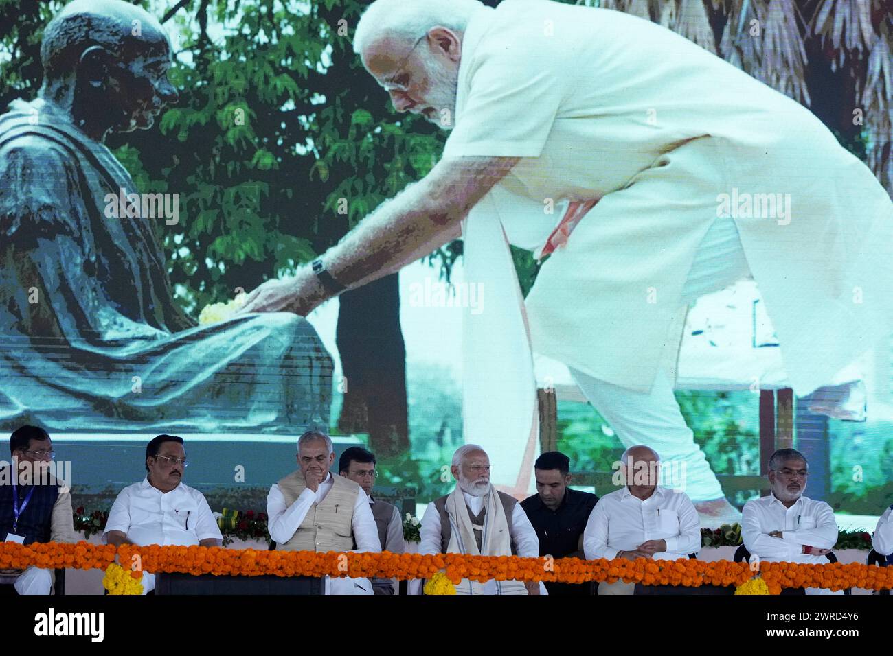 Indian Prime Minister Narendra Modi, center, sits during the launch of ...