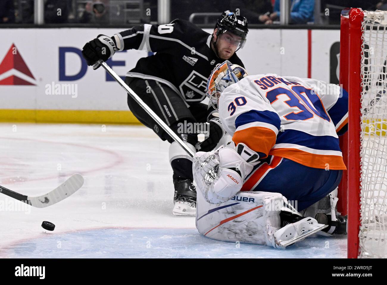 Los Angeles Kings center Pierre-Luc Dubois, left, shot gets deflected ...