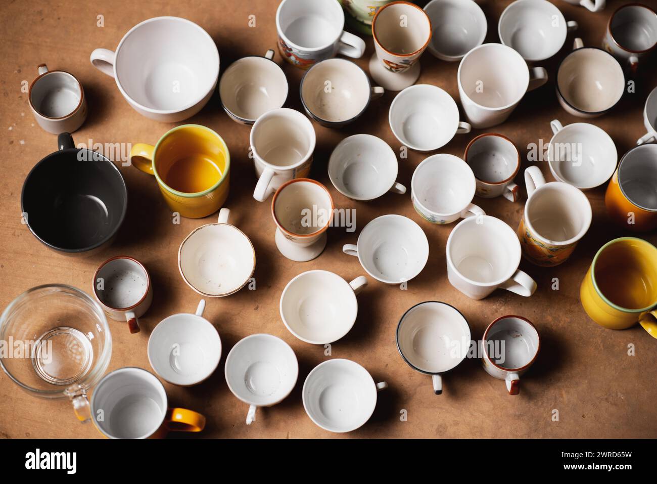 Lots of different empty cups on the floor. Coffee, tea cups Stock Photo ...