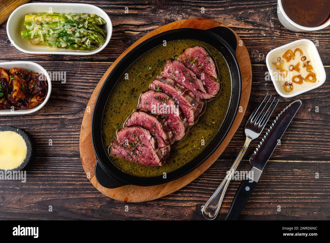 Sliced grilled tenderloin flavored with sauces after being seared on ...