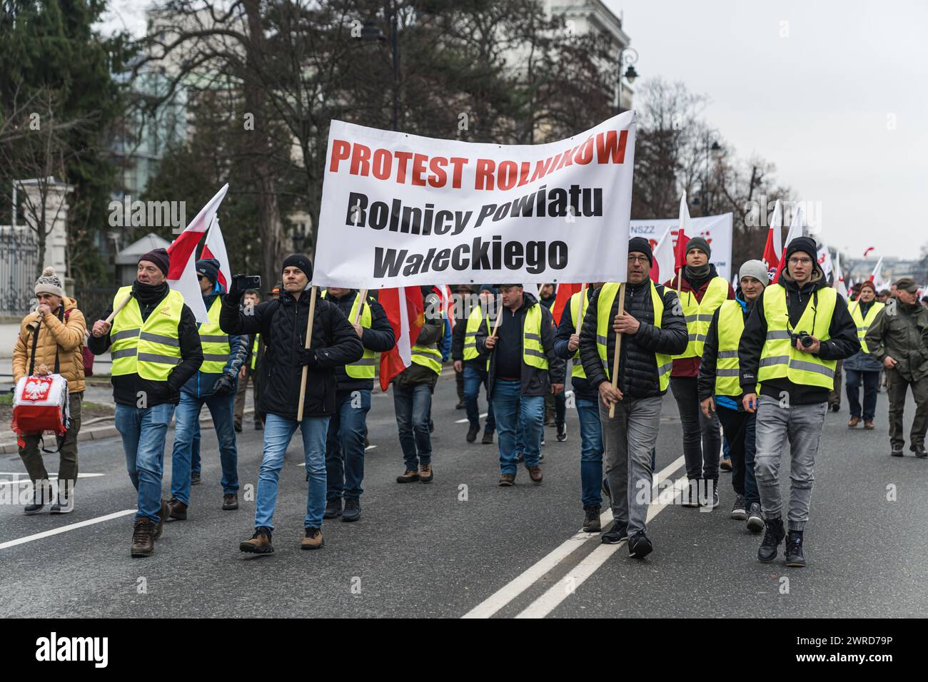 06.03.2024. Warsaw, Poland. polish men carrying a banner saying protest ...