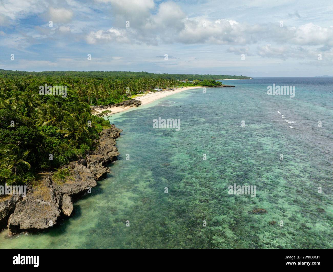 White beach and turquoise sea water and coral reefs. Carabao Island ...