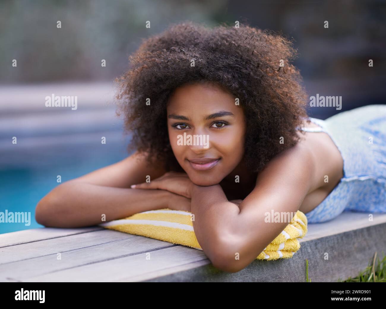 Portrait, deck and black woman relax at poolside for travel, break or ...