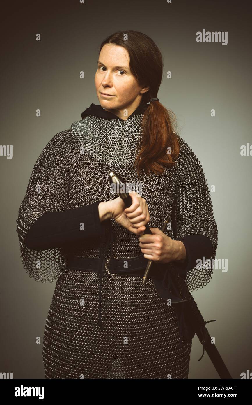 Medieval infantry armed woman dressed in chain armor Stock Photo - Alamy