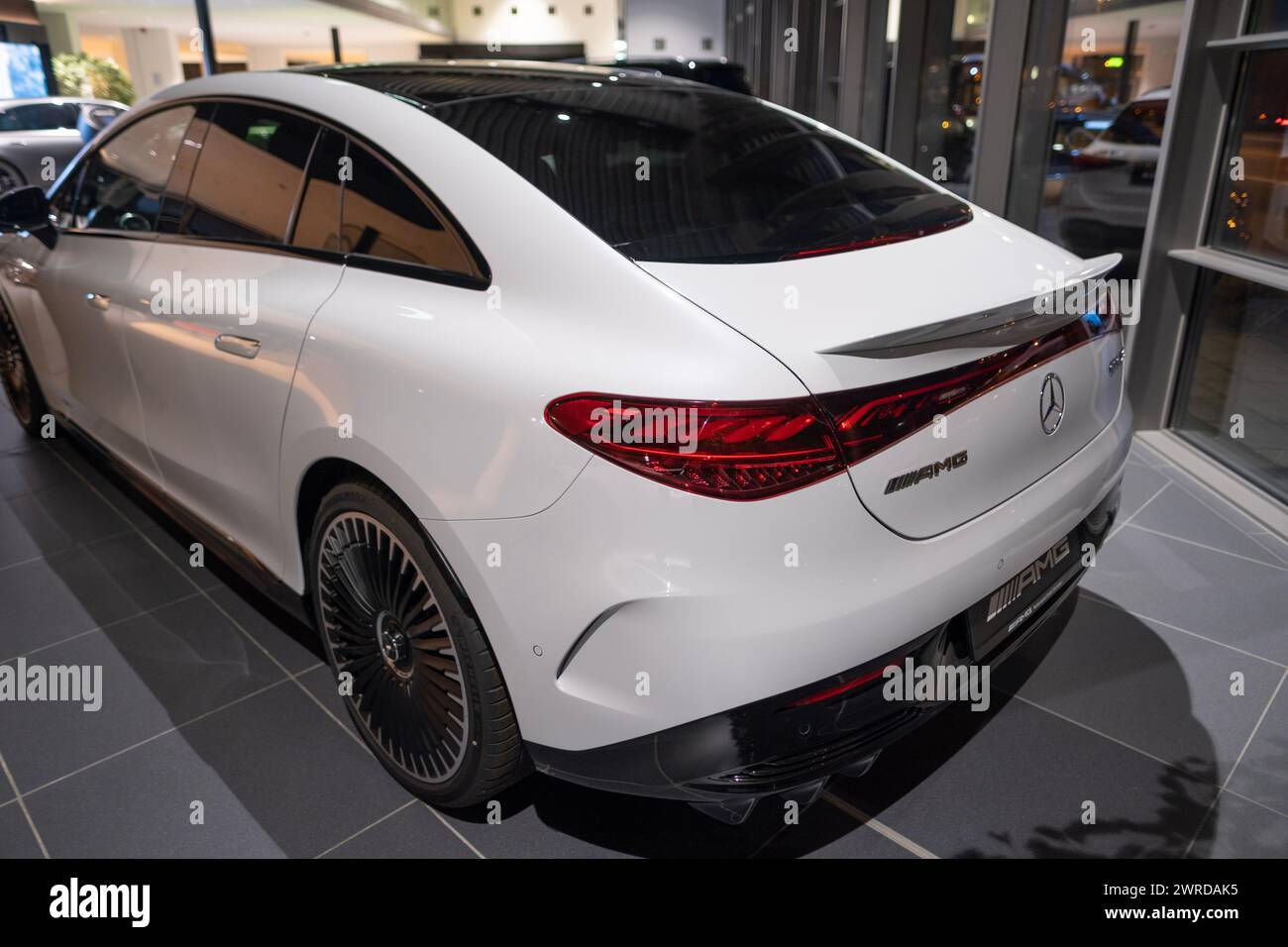 new white electric Mercedes EQE 53 sedan, car in showroom, EV Mercedes ...