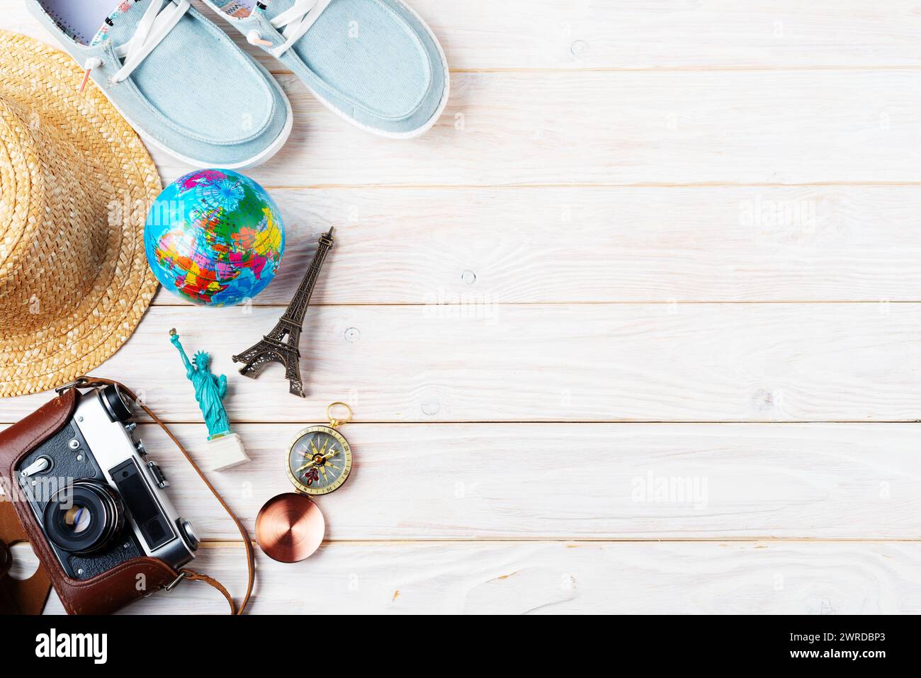 Travel planning simple background of compass, film camera, straw hat ...