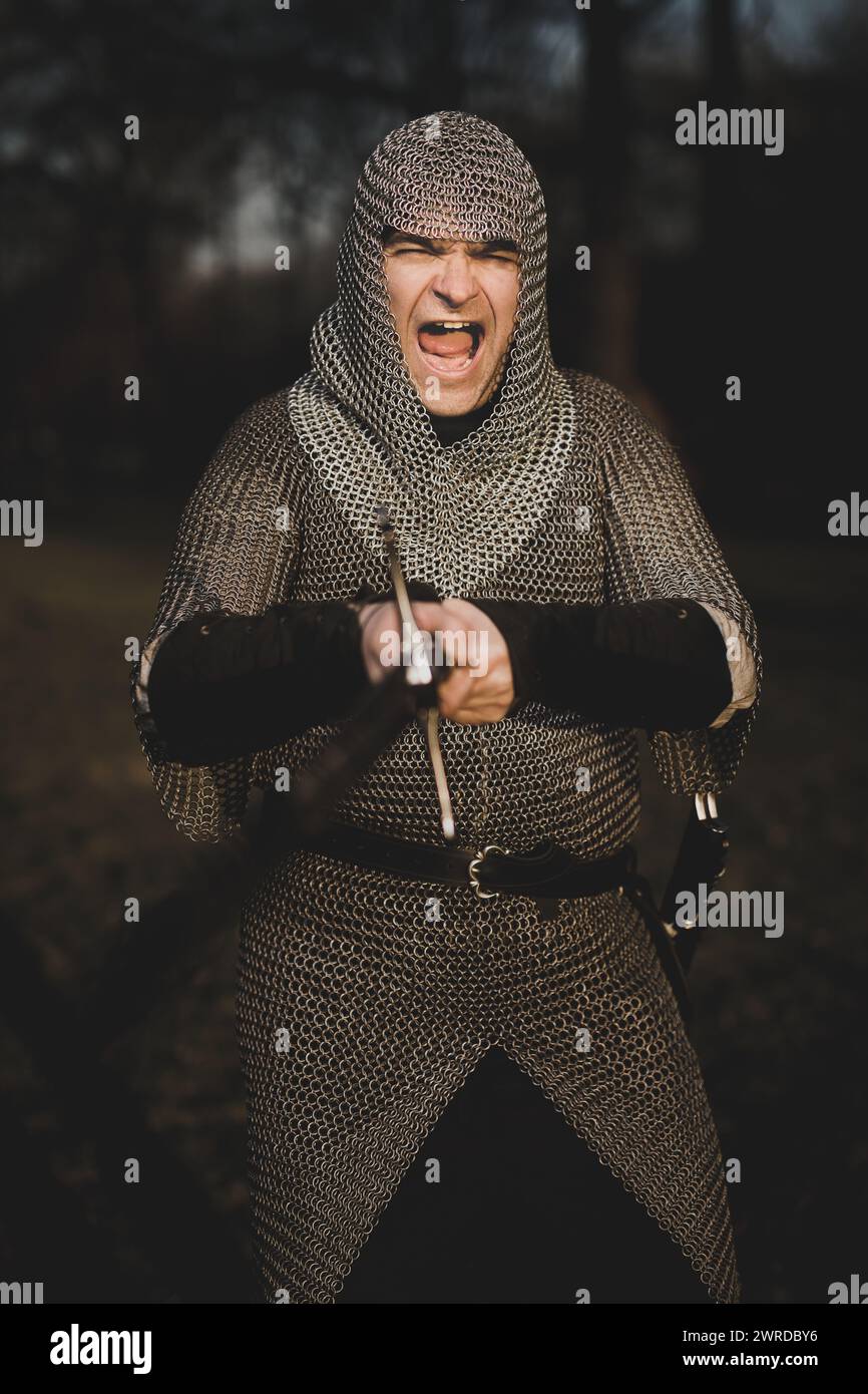 Medieval infantry armed man dressed in chain armor outdoor Stock Photo ...
