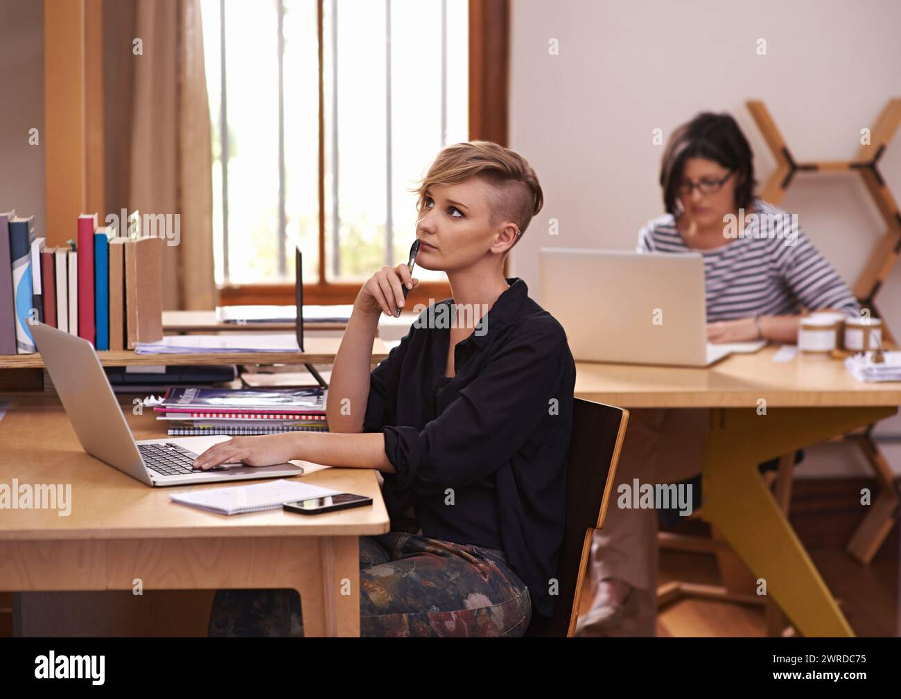 Thinking, laptop and woman student in library for studying, planning ...