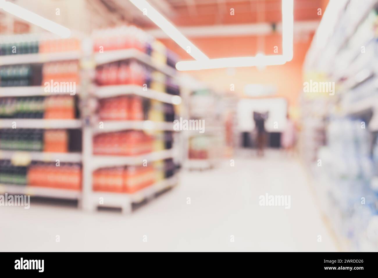 Supermarket aisle with beverage product shelves blur background Stock ...