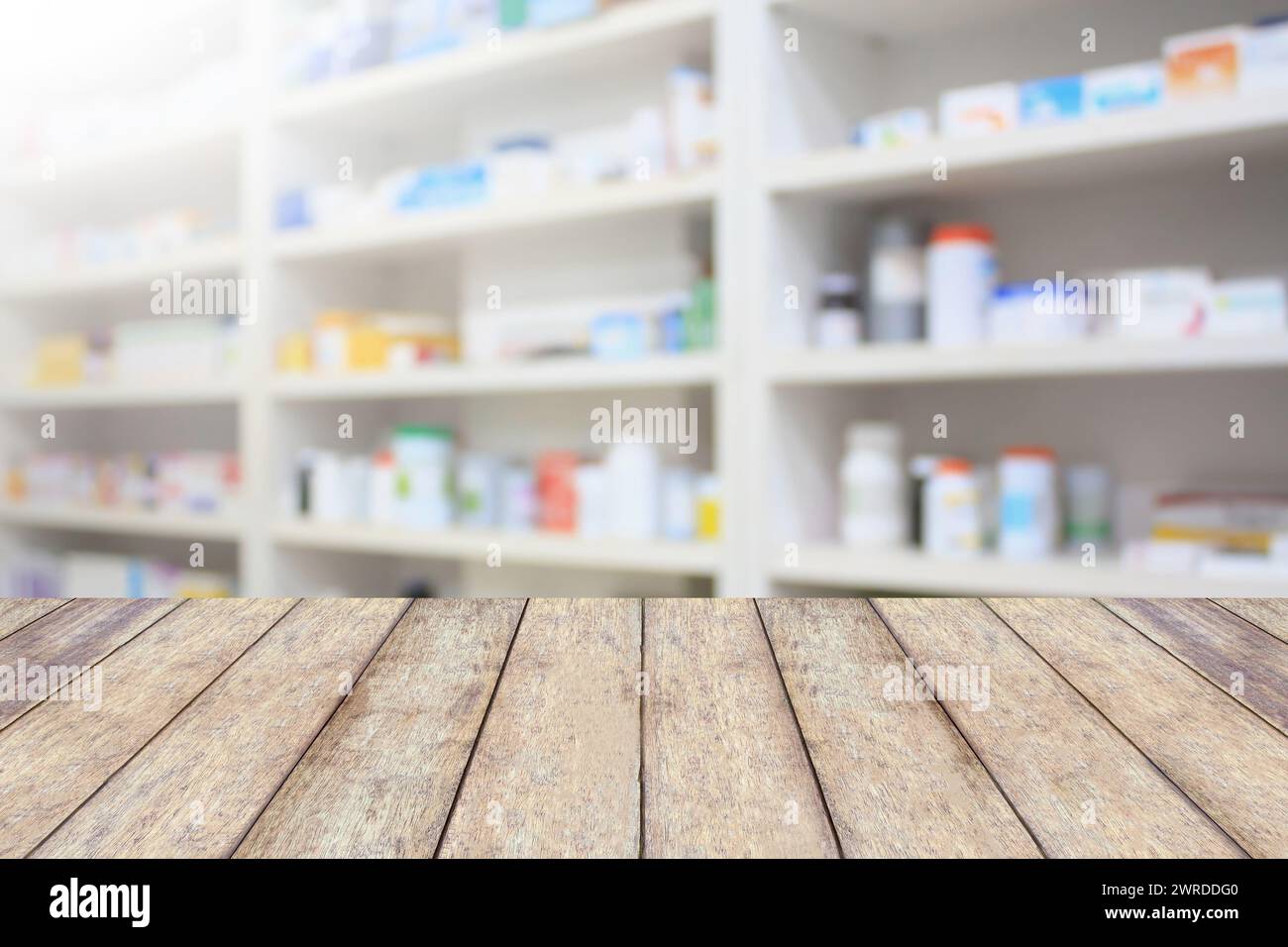 pharmacy product display counter with drugstore shelves background ...