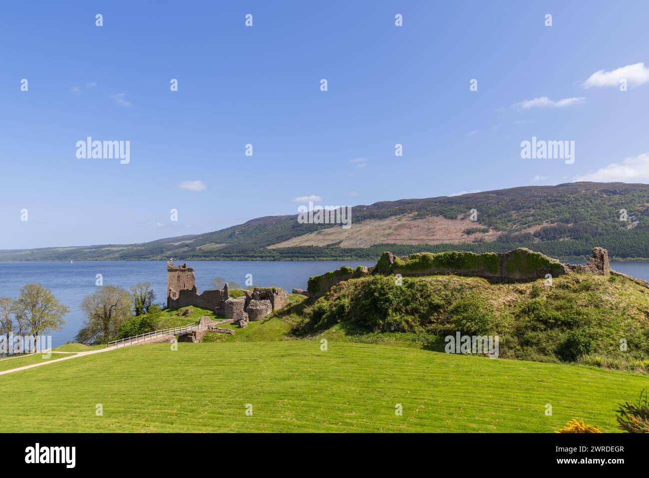 Overlooking the expansive waters of Loch Ness, Urquhart Castle's ruins ...