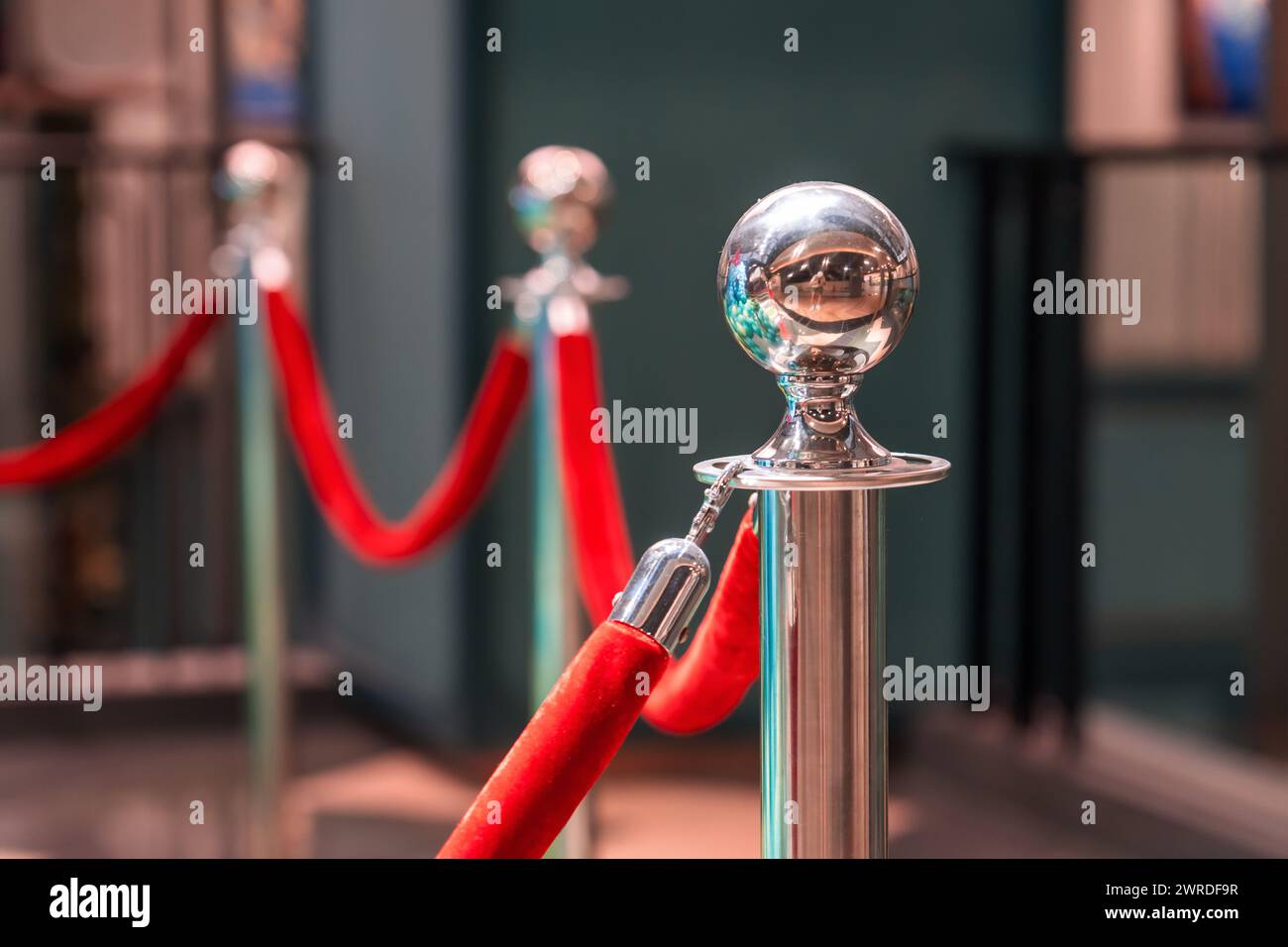 Rope fencing with gold pillars with a red carpet for celebrities and ...