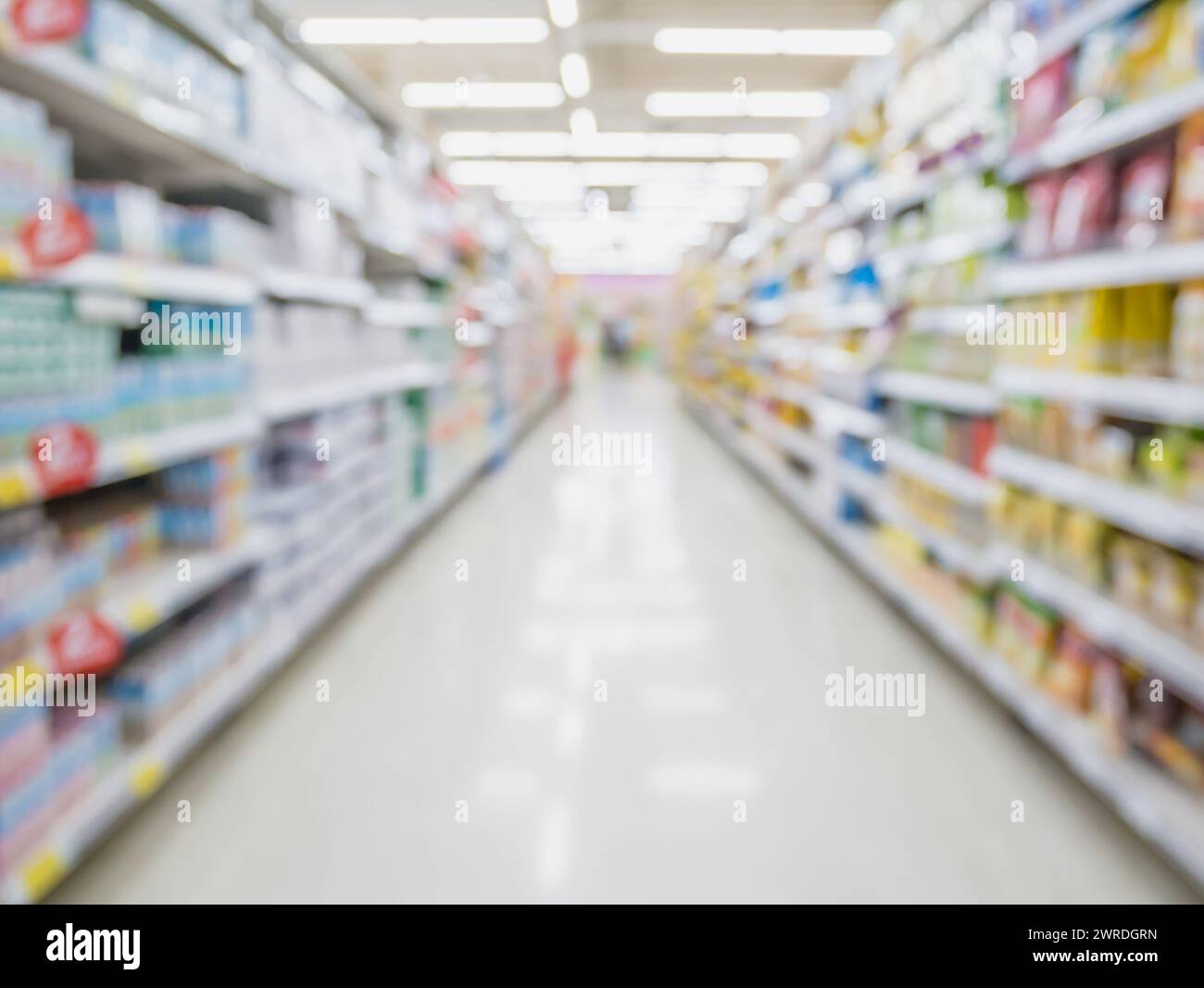 Empty Supermarket Aisle and Shelves in blurry for background Stock ...