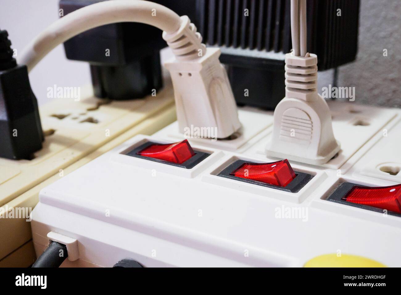 Multiple power socket with connected plugs Stock Photo - Alamy