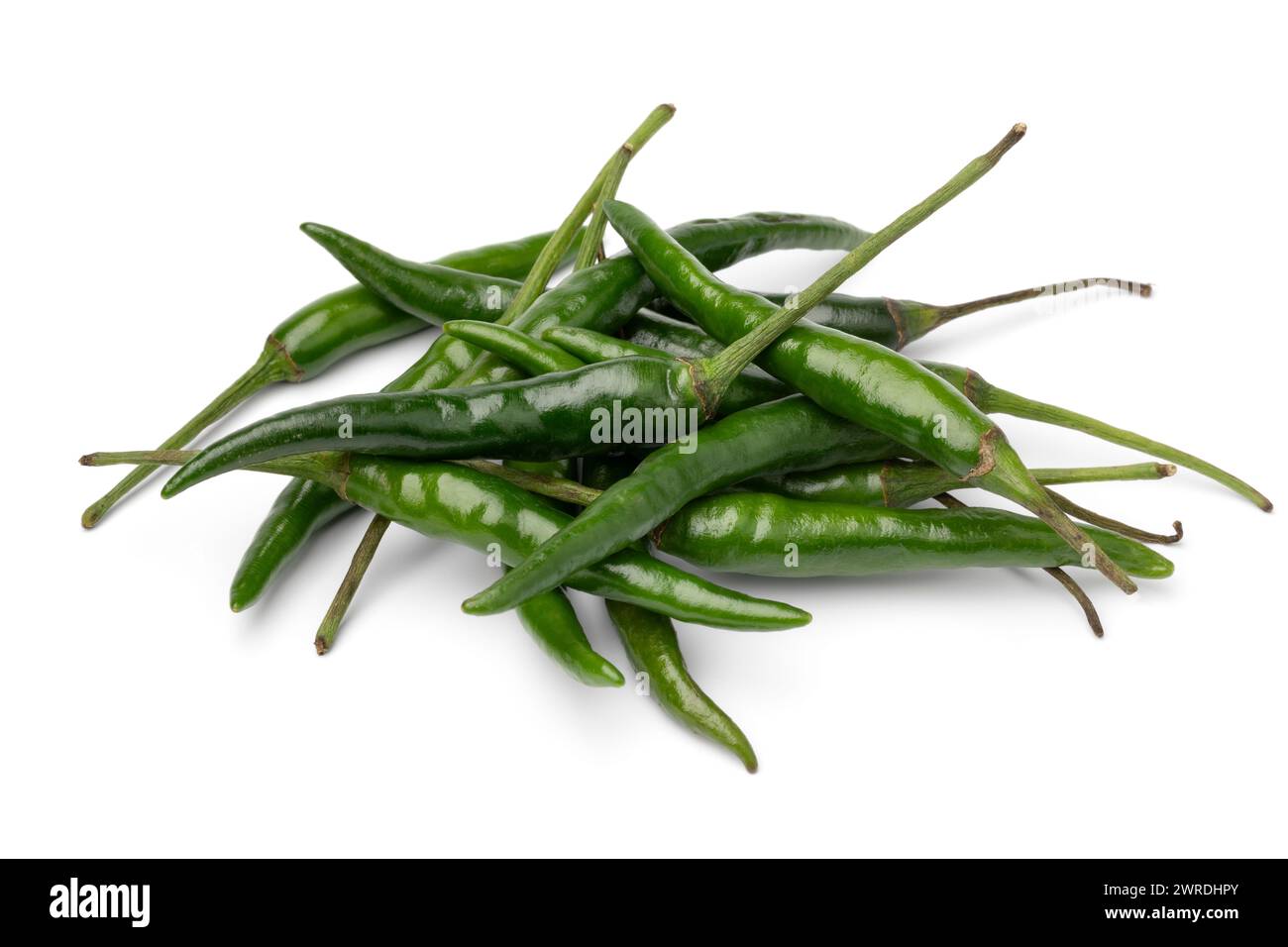Heap of whole fresh raw green rawit peppers close up isolated on white ...