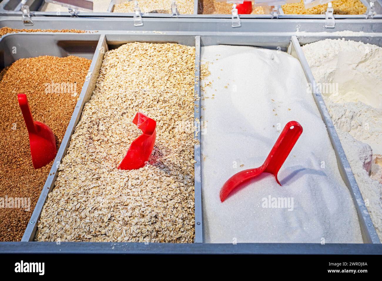 bulk cereals, sugar, flour in containers by weight in the supermarket ...