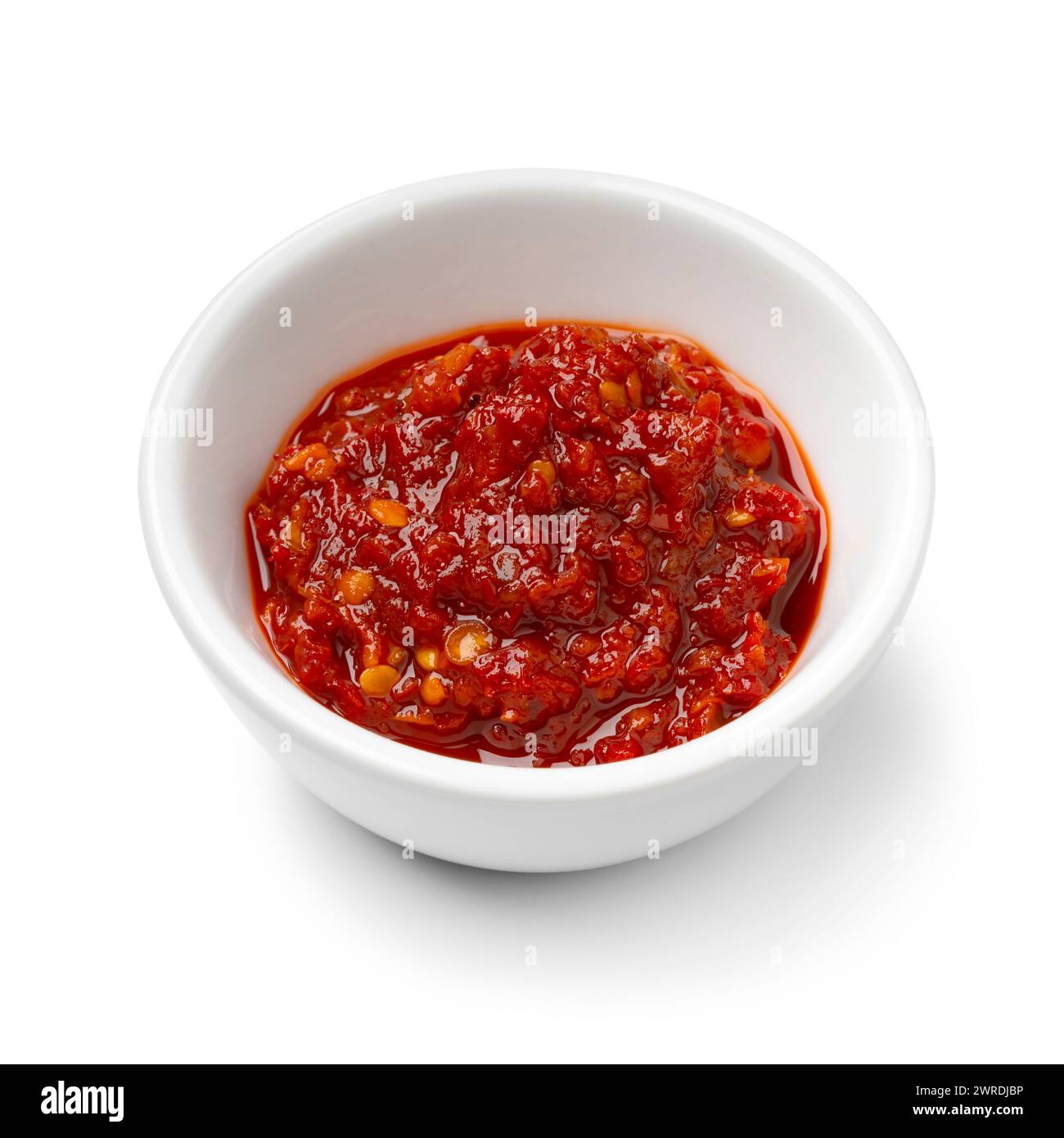 Single white bowl with sambal sauce isolated on white background close ...