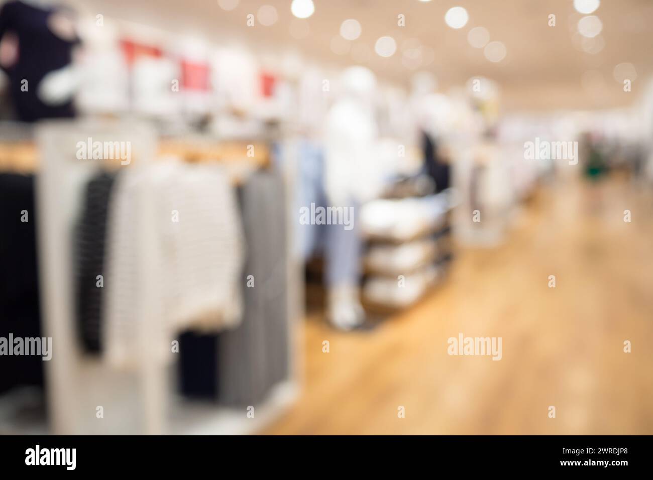 clothing store in shopping mall boutique shop interior blur defocused ...