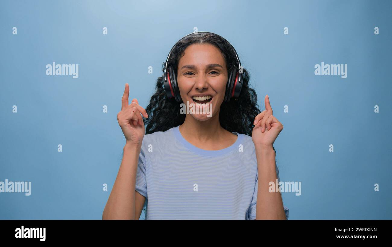 Studio portrait happy smiling singing Arabian woman Indian lady ...