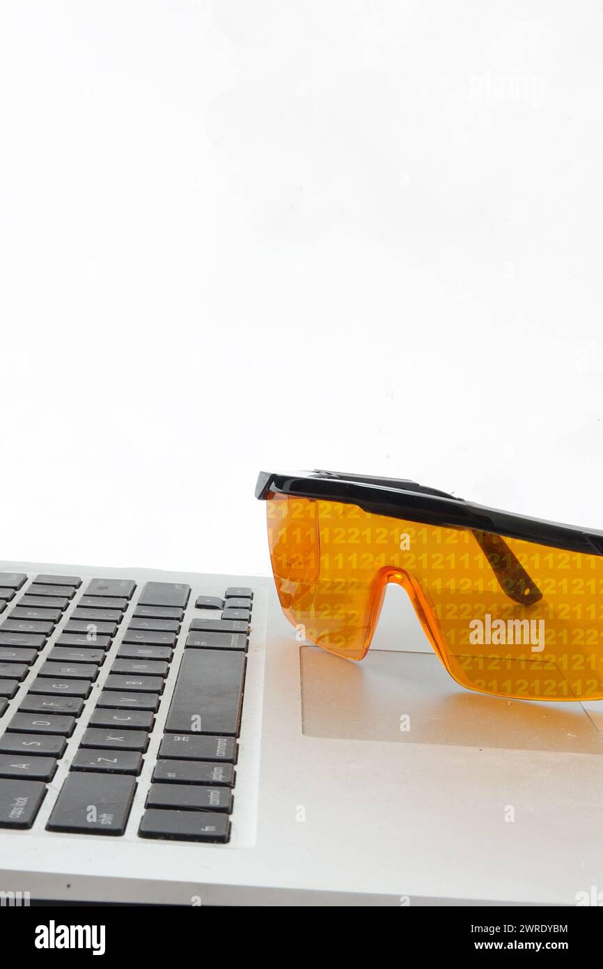 The blue light blockers has data reflected on the lenses Stock Photo ...