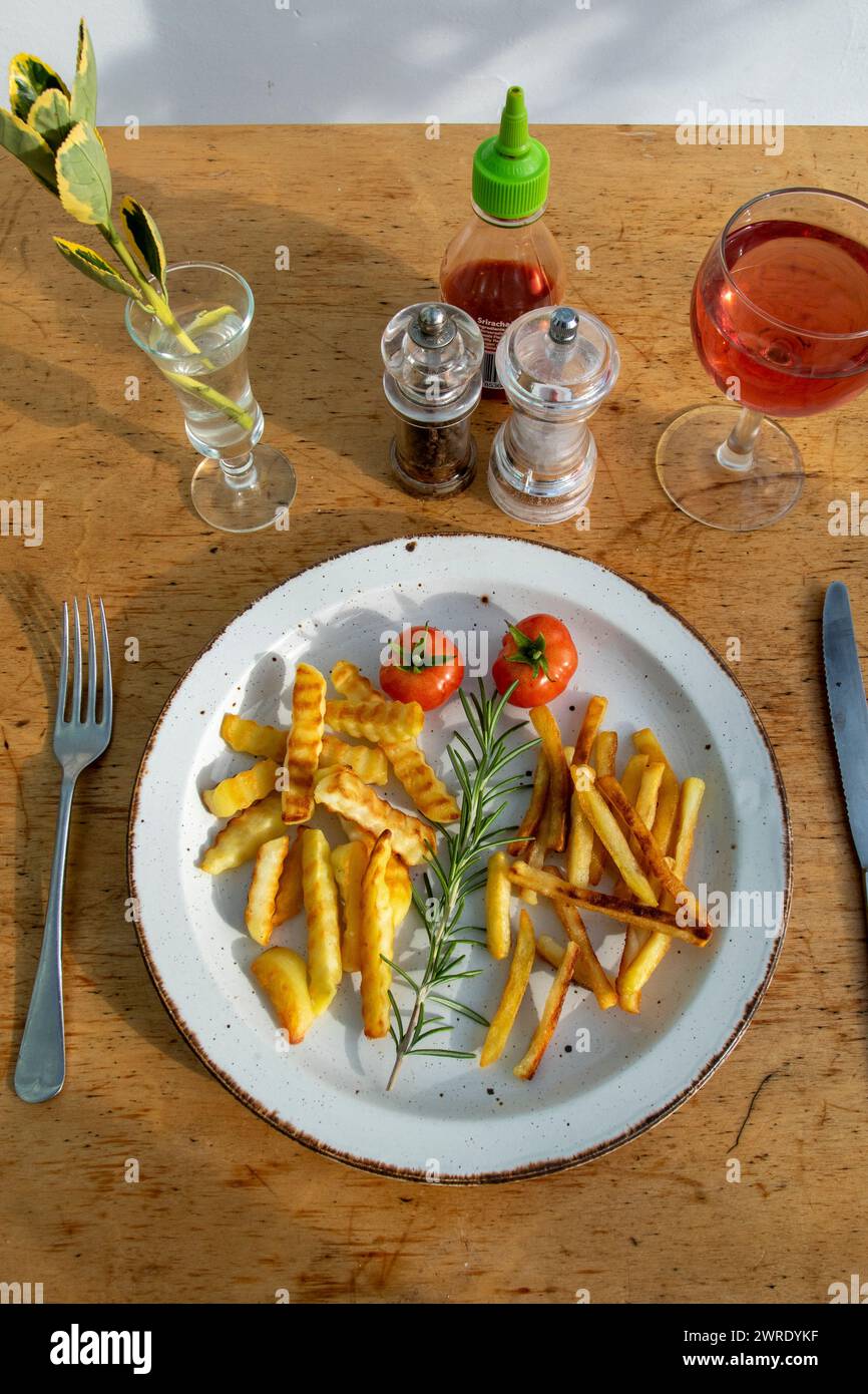 An elegantly simple dinner place setting with a main course of chips ...