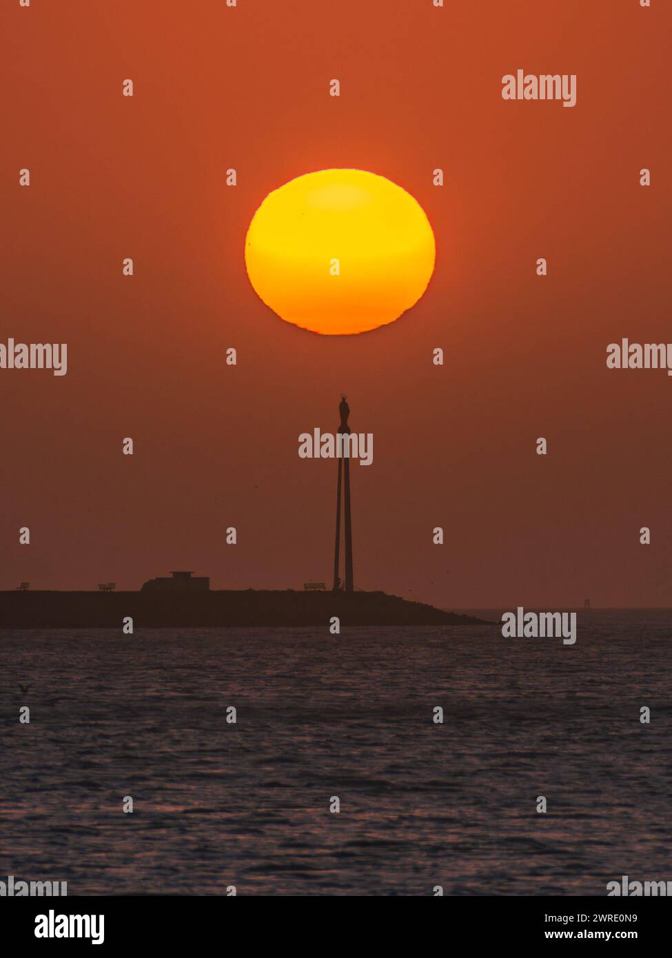 Hazy sun rising over the North Bull Wall on a mid-February morning ...